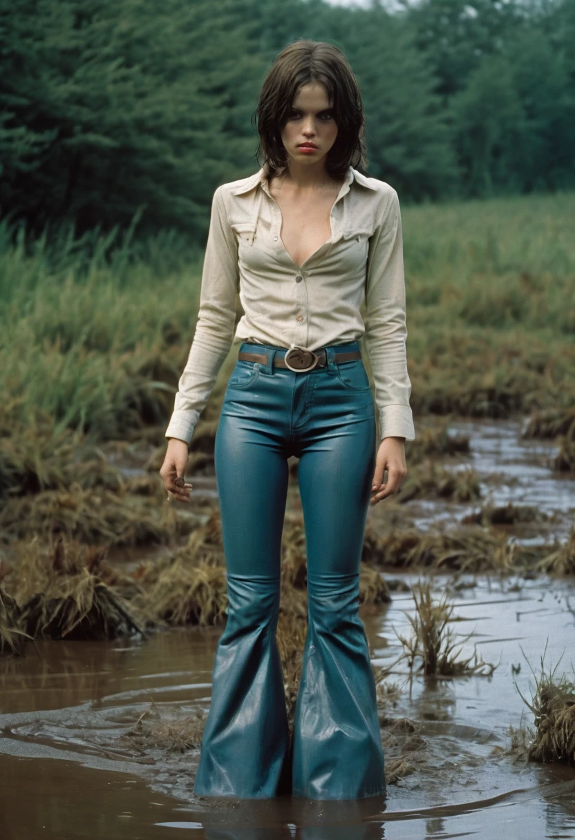 70s setting provocative girl wearing soaking wet muddy flared jeans ...