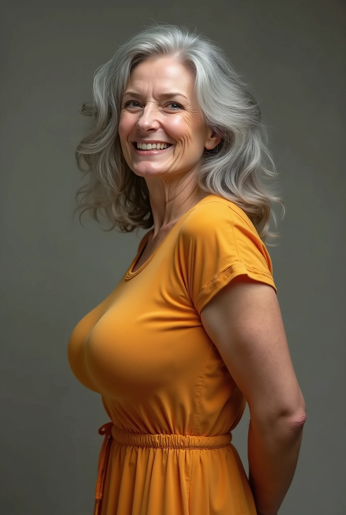 Smiling Woman In Orange Dress Posing For A Picture With Gray Hair