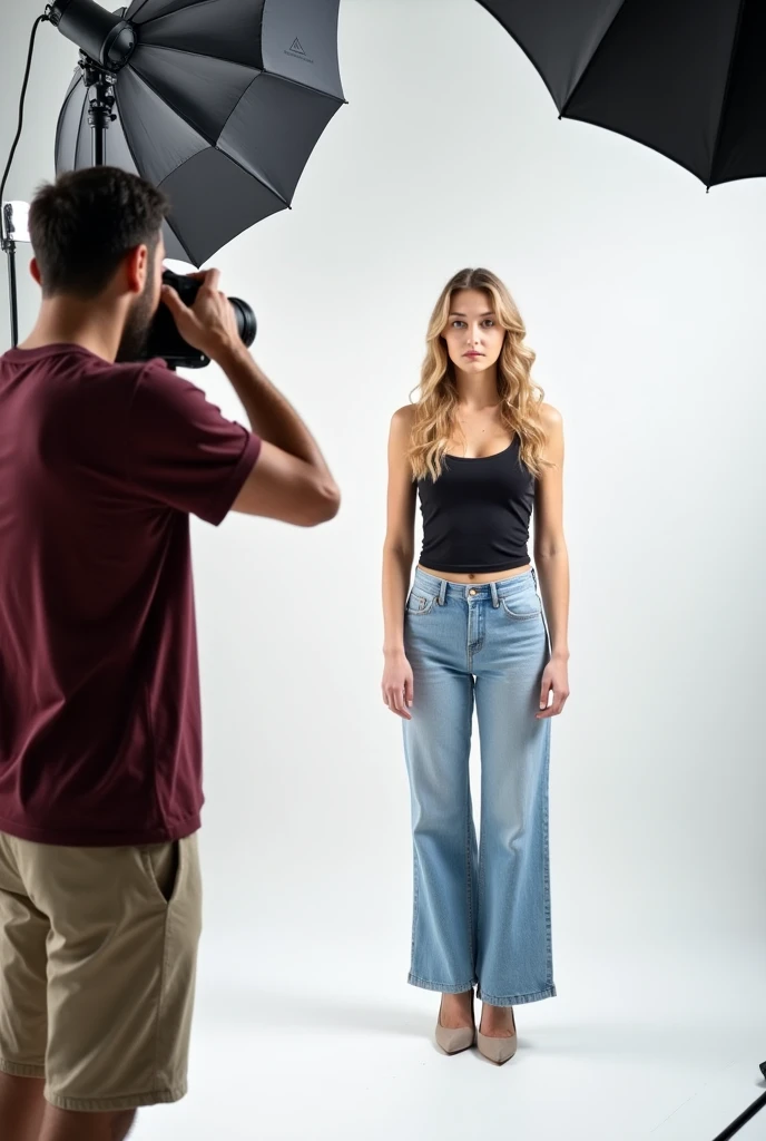 Studio photoshoot; professional photographer kneeling, capturing image ...