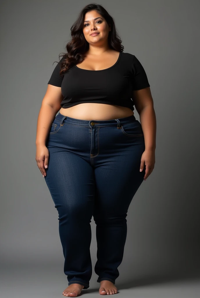6 foot tall plus-size model with black crop top and tight dark blue ...