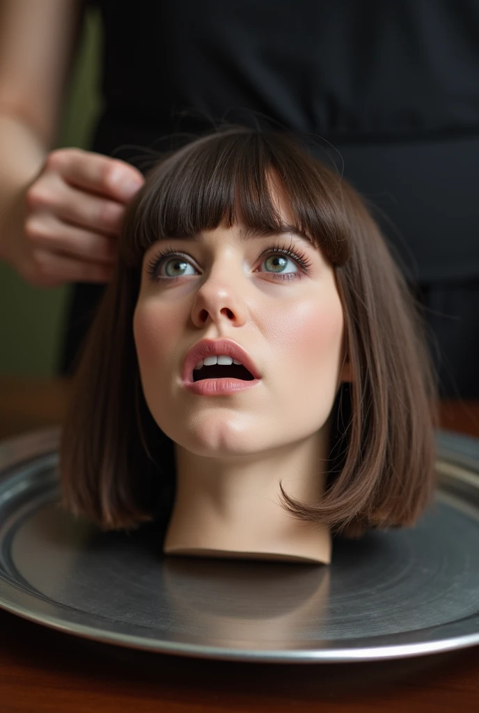 A beautiful young european woman's disembodied head is lying on a ...