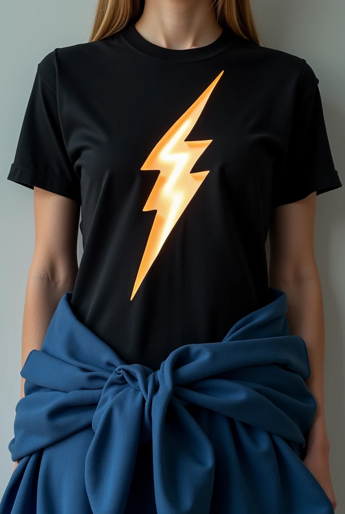 A black t-shirt with a huge flat in the center in the shape of ...