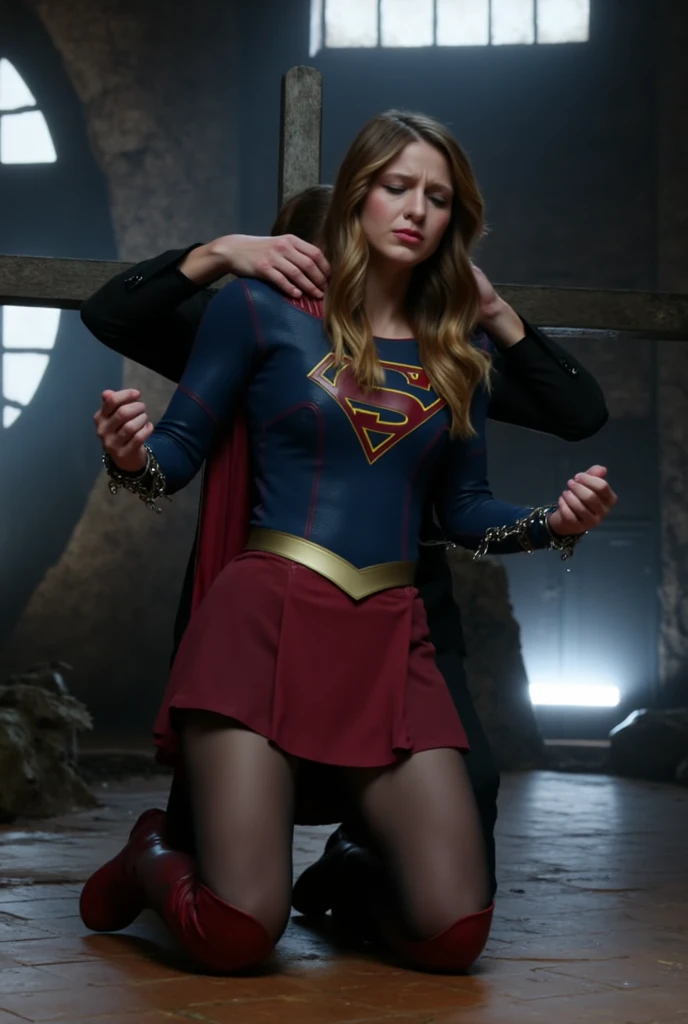 Melissa Benoist as Supergirl, the Supergirl is kneeling crucified ...