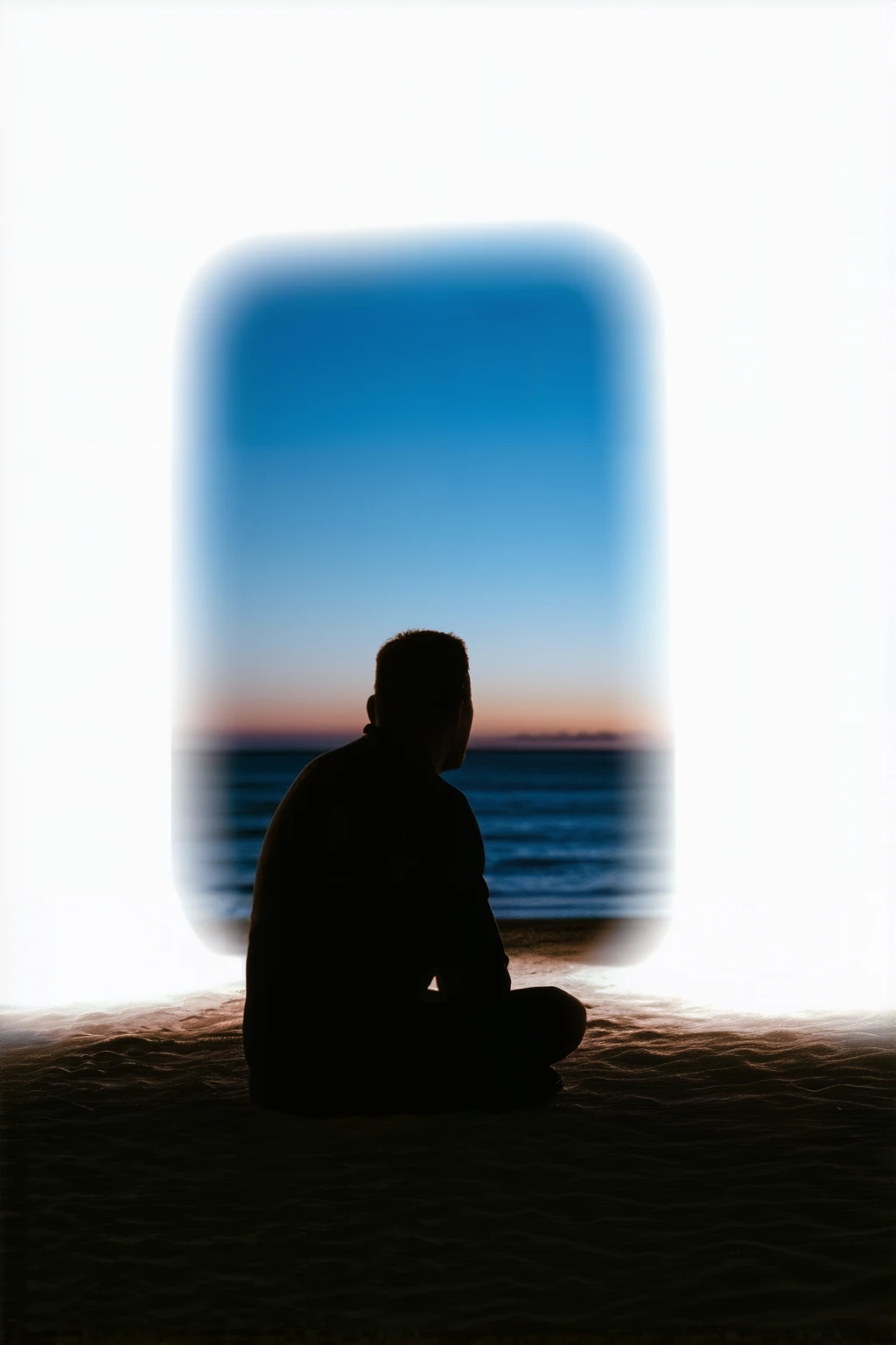 A man sitting on the ground in the dark,Sitting by the seaside at night ...