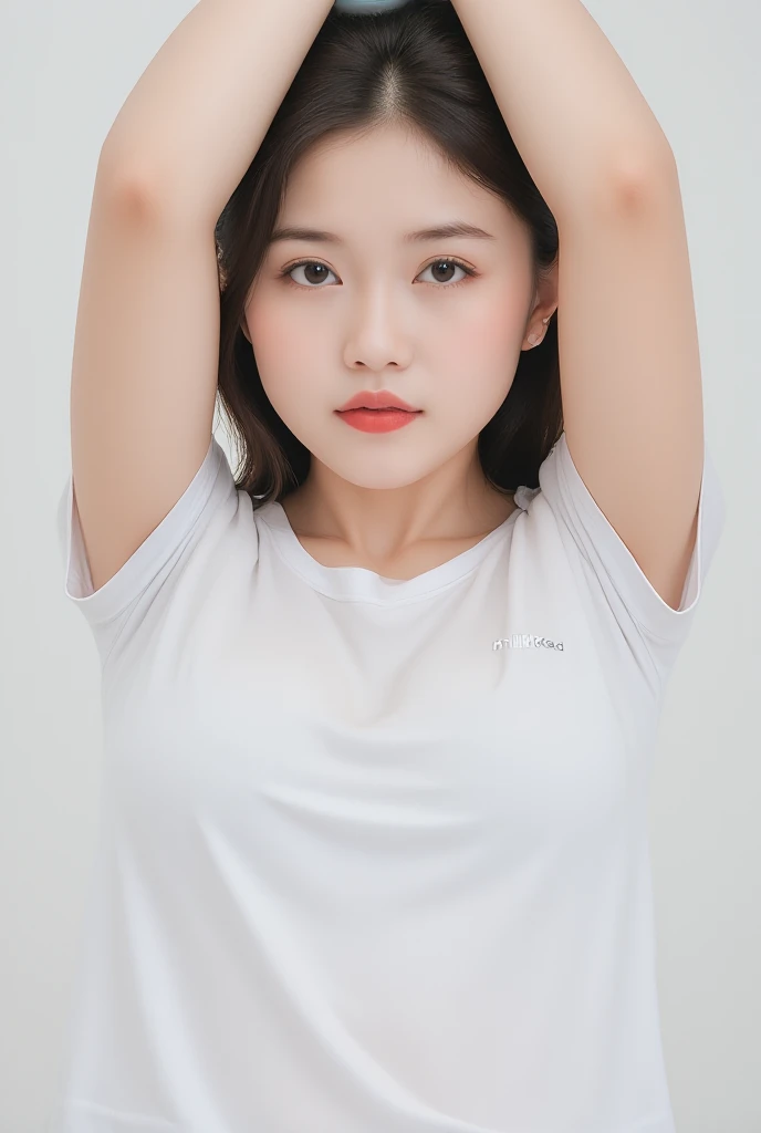 A Japanese woman wearing a MilkFed logo t-shirt, restraining her hands ...