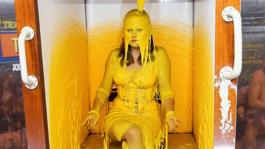 On the set of a TV gameshow that is elaborately decorated with lots of ...