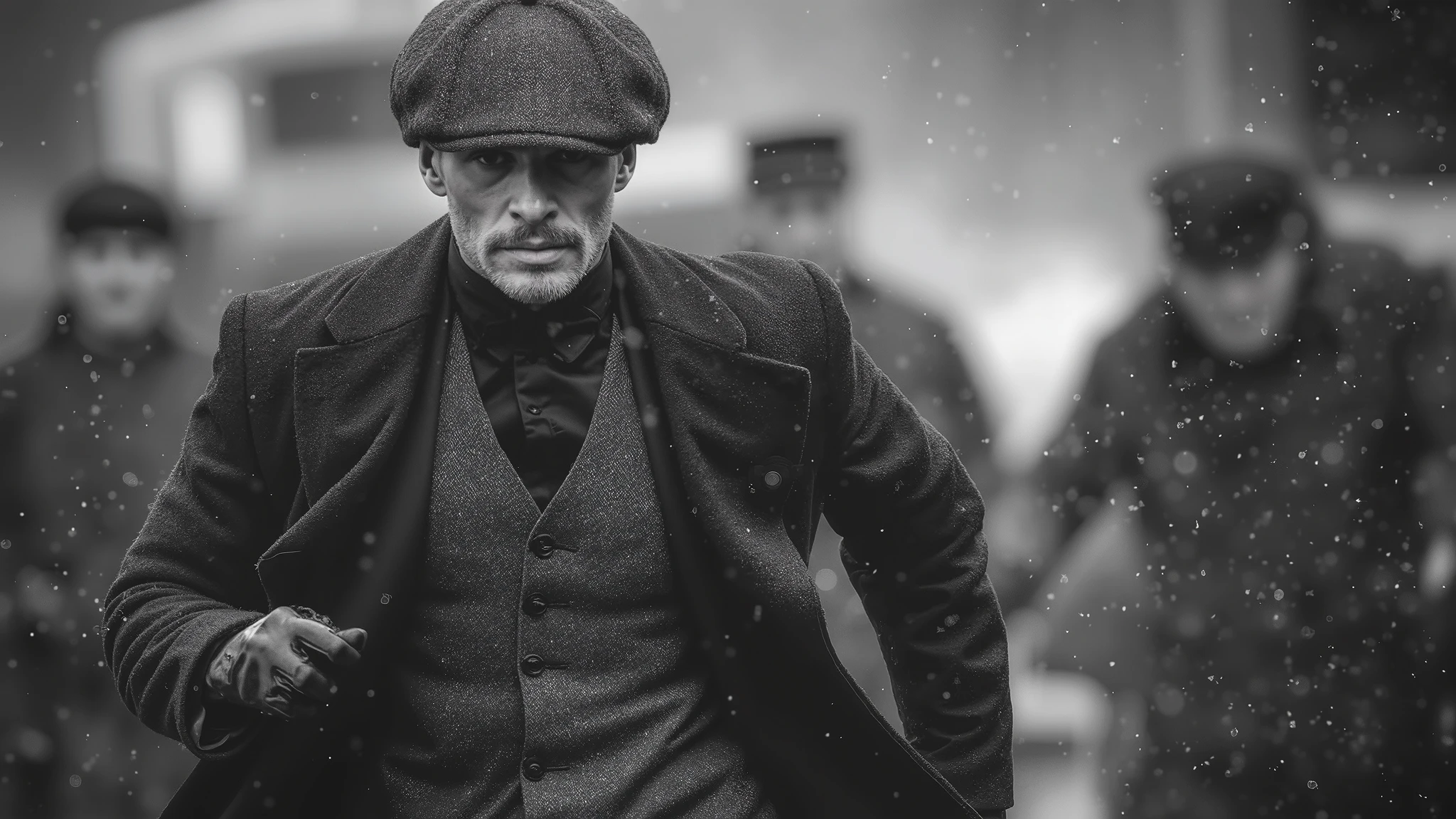 Black and white cinematic image of a man wearing a 1920s flat cap and ...