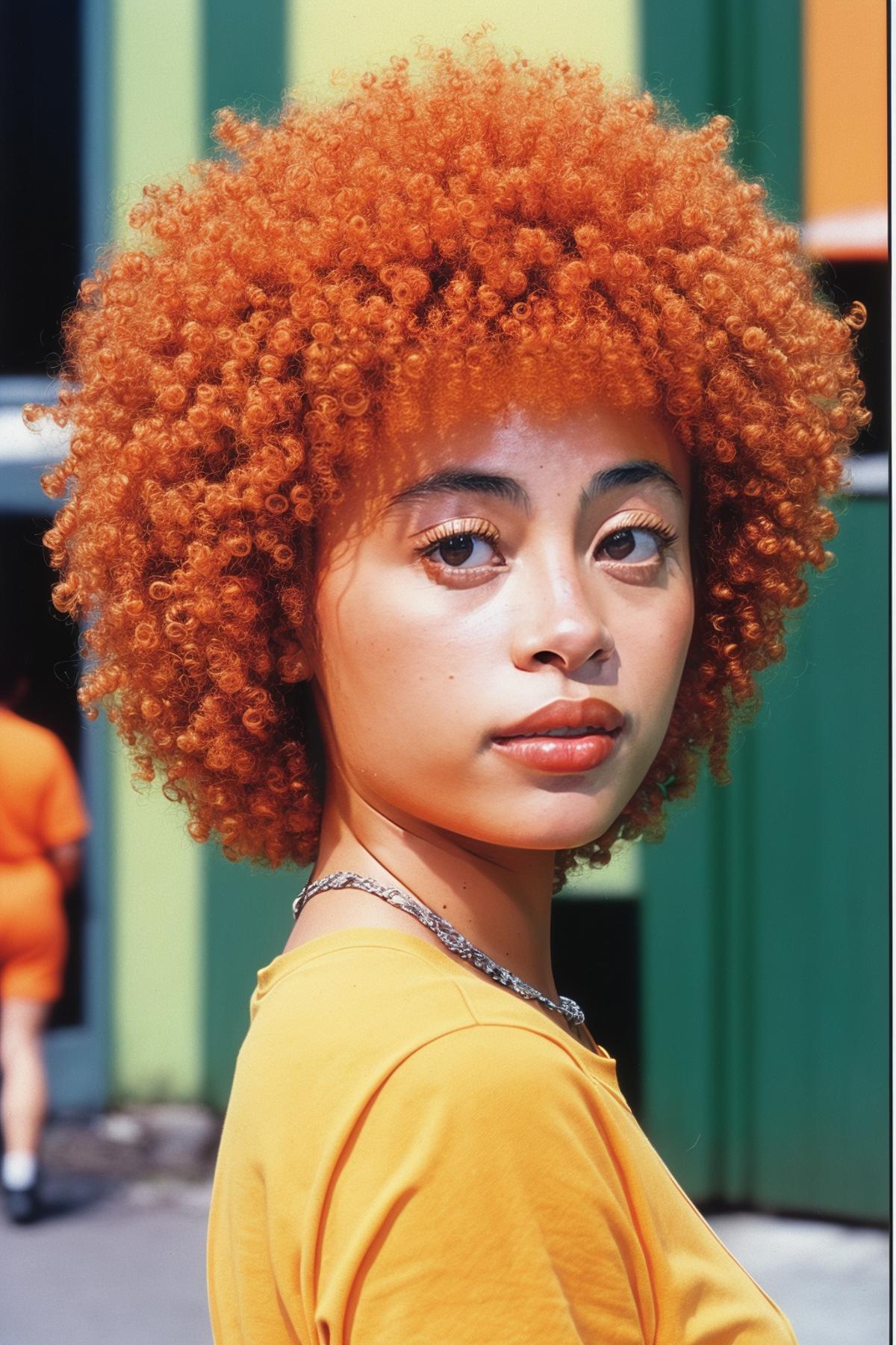There is a woman with an orange afro standing in front of a building ...